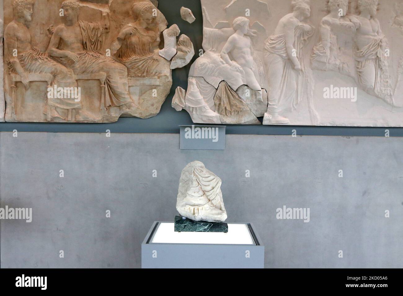 A marble fragment (Center) from the Parthenon, believed to depict the ...