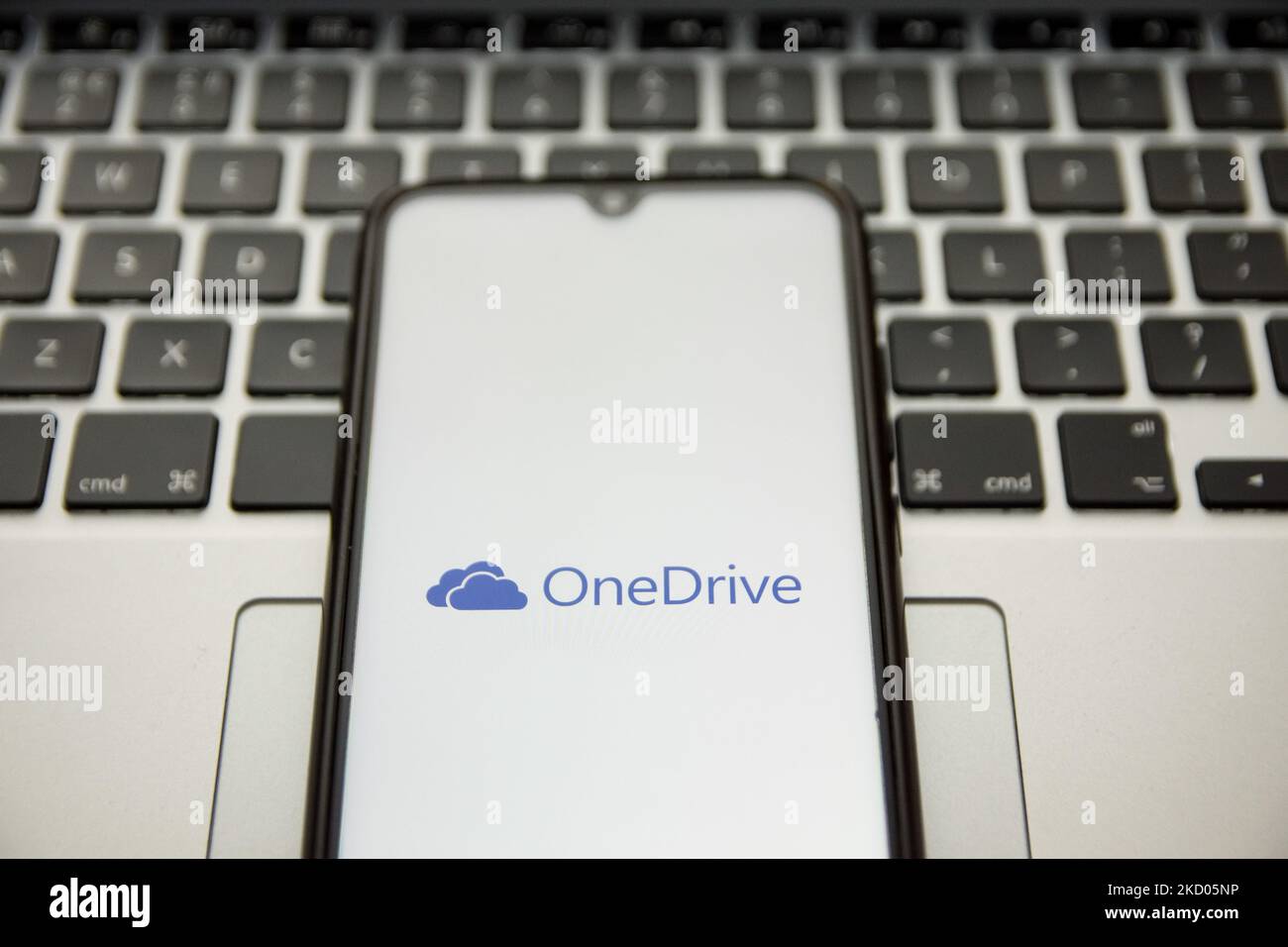In this photo illustration an OneDrive logo seen displayed on a ...