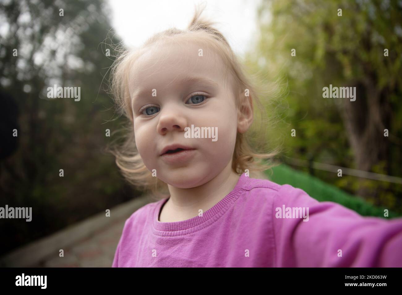 little caucasian girl taking a selfie, little blogger Stock Photo - Alamy