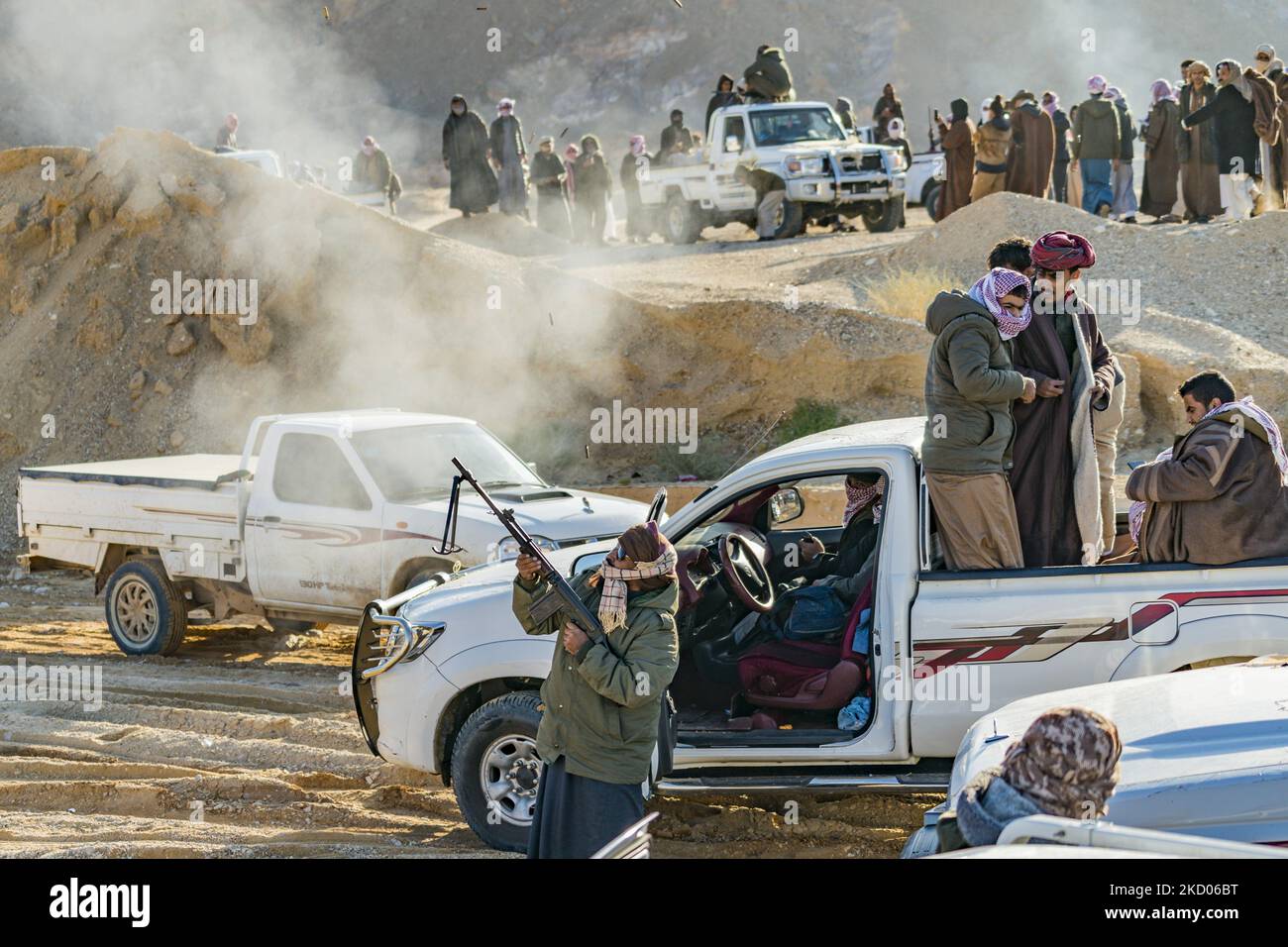 A man celebrates the end of the Wadi Zalaga annual camel race shooting ...