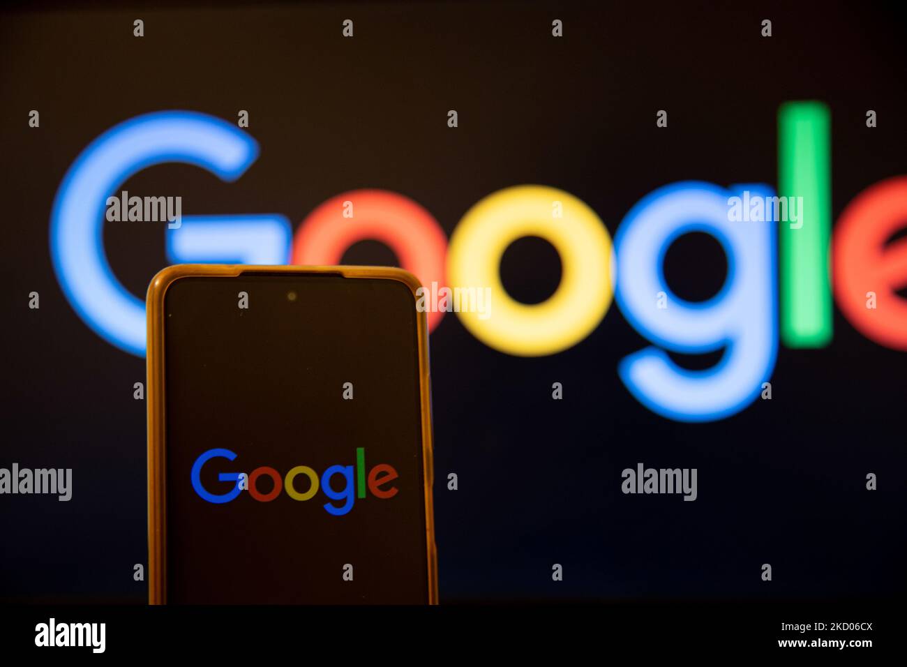 Google logo on a phone and a computer screen. Google closeup logo ...
