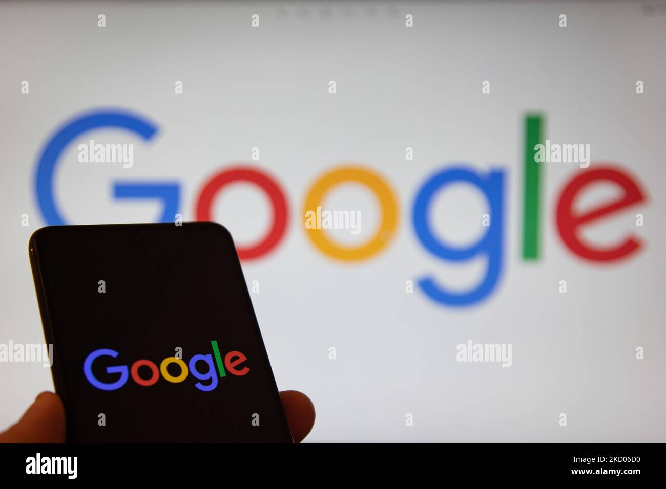 Google logo on a phone and a computer screen. Google closeup logo ...