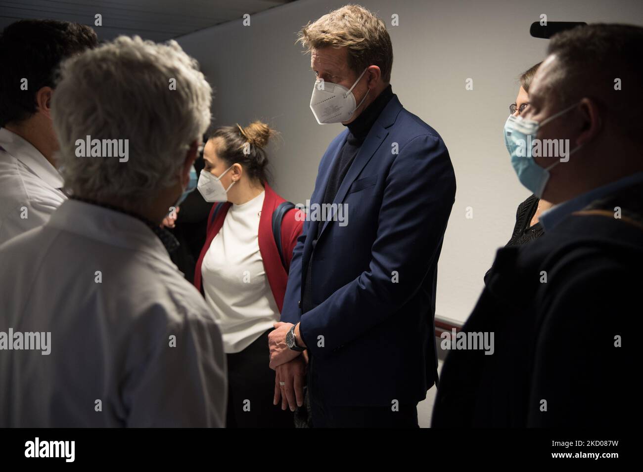 Yannick Jadot discusses with medical staff in the intensive care unit ...