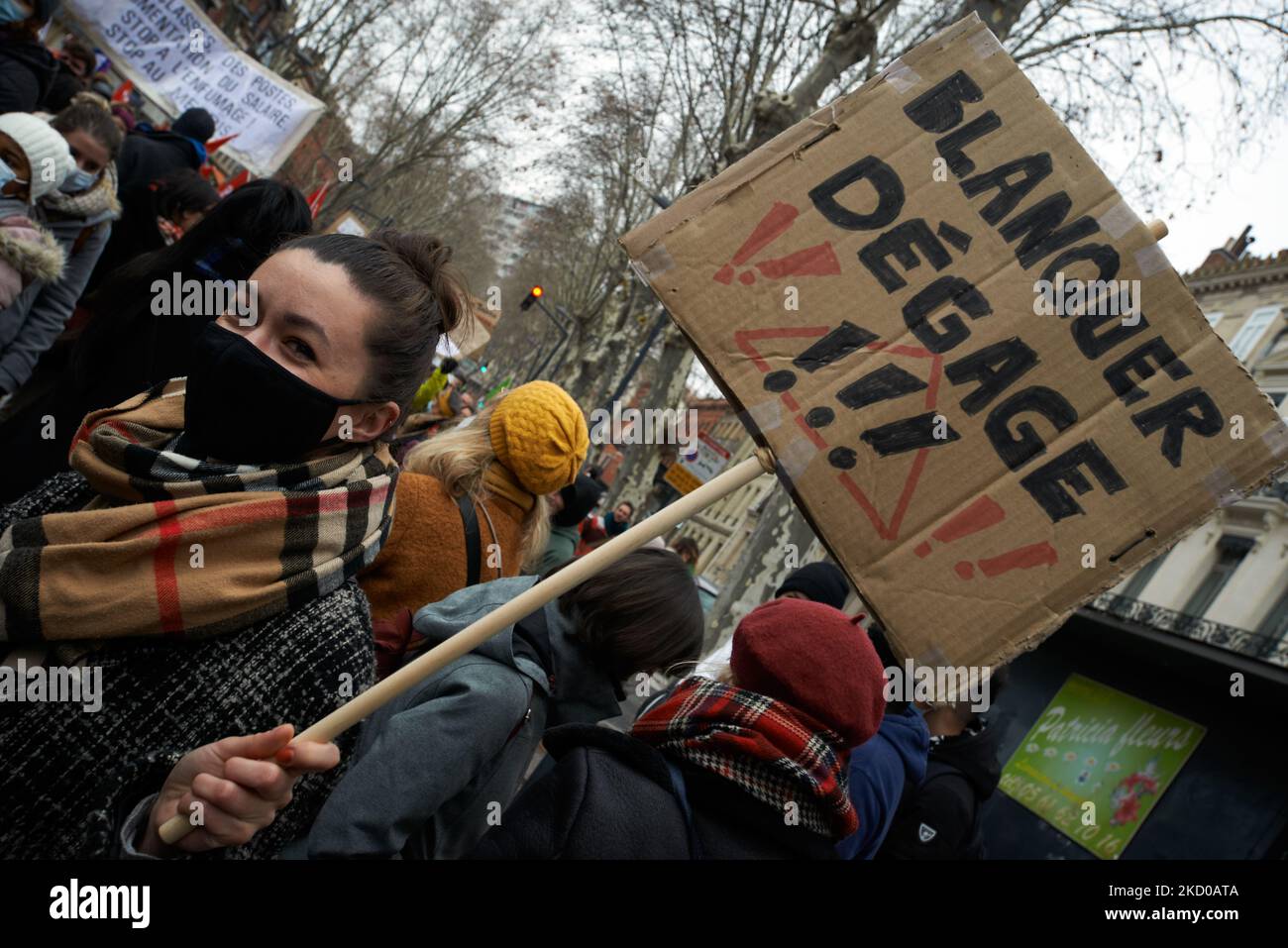 A woman sows a sign reading 'Blanquer Get out !!!' Thousands of ...