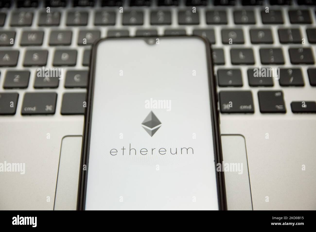 In this photo illustration an Ethereum logo seen displayed on a ...