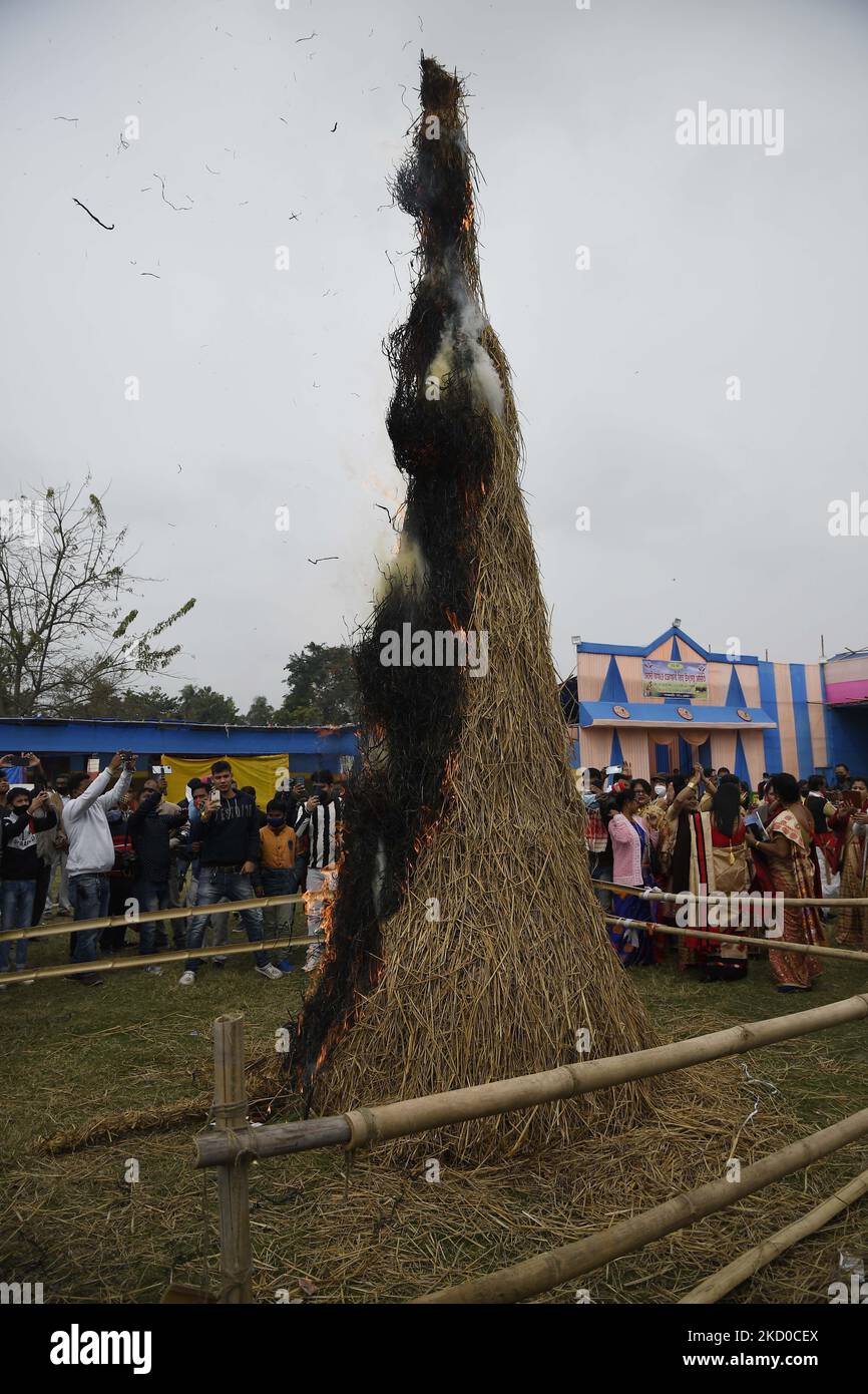 Traditional Assamese 'Meji', a house made of straw, being burnt during ...