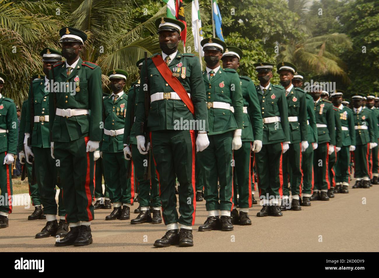 Members of the Nigerian Armed Forces stand in line carrying wreath during the commemoration of ...