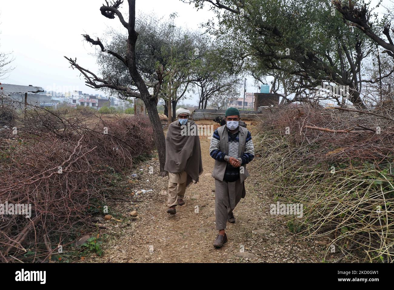 Gujjar Men walk outside their residence in Roop Nagar Jammu, Jammu and ...