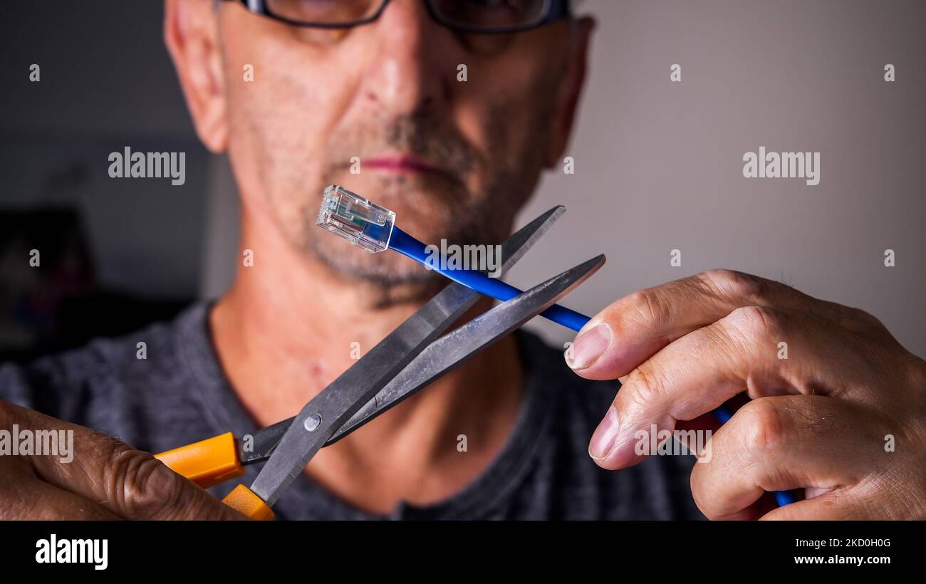 Close up from cutting hdmi cable with scissors Stock Photo - Alamy