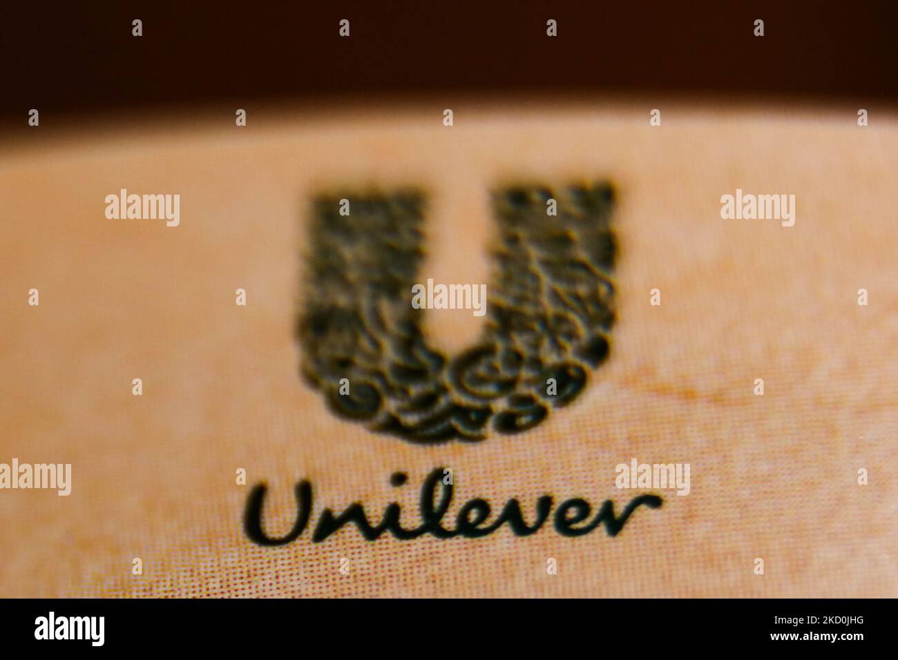 Unilever logo is seen on the product packaging in this illustration ...