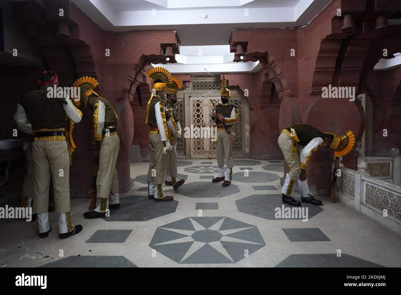 Indian soldiers adjust their uniforms during a break at the rehearsal ...