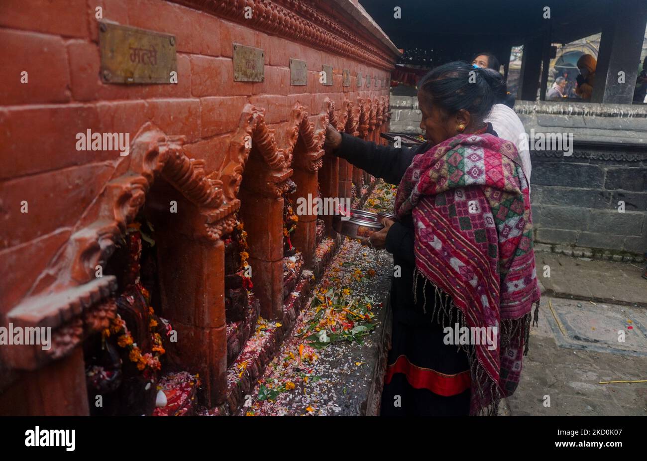 Hindu devotee perform a ritual on the bank of the Hanumante River ...