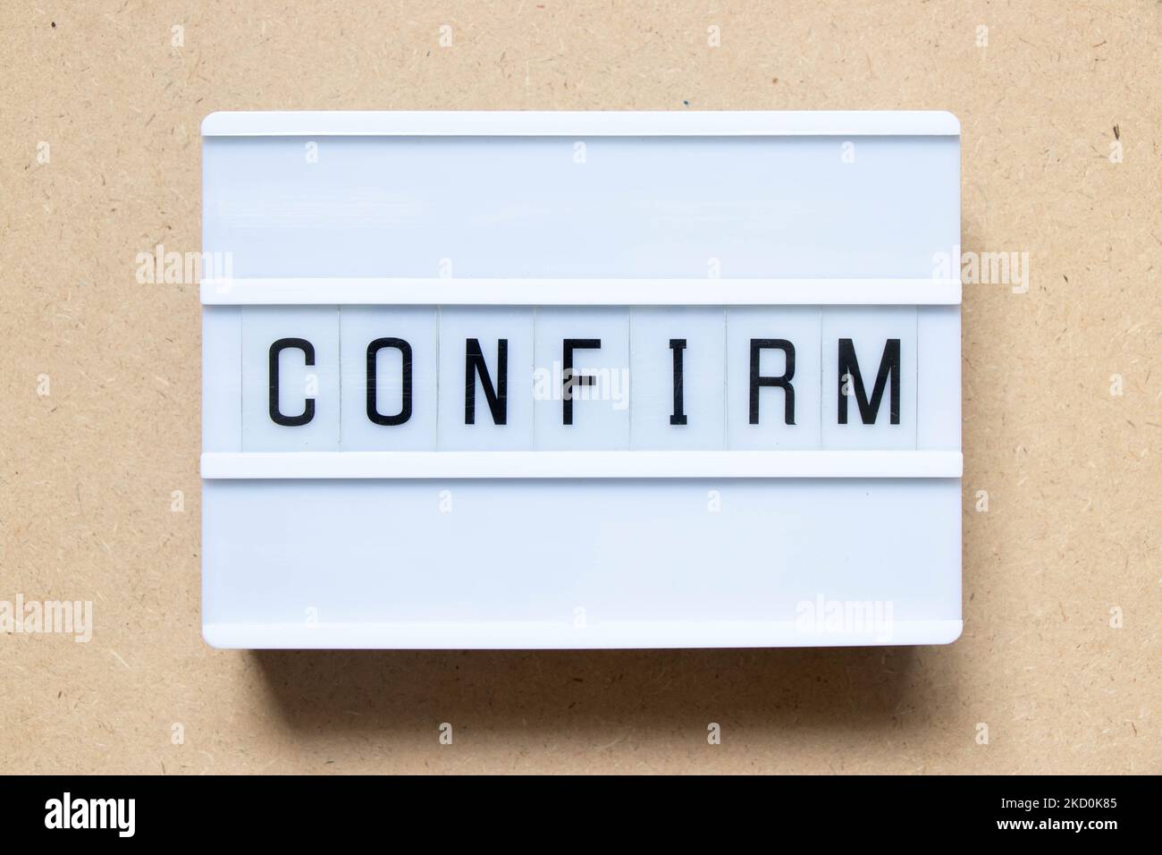 Lightbox with word confirm on wood background Stock Photo - Alamy