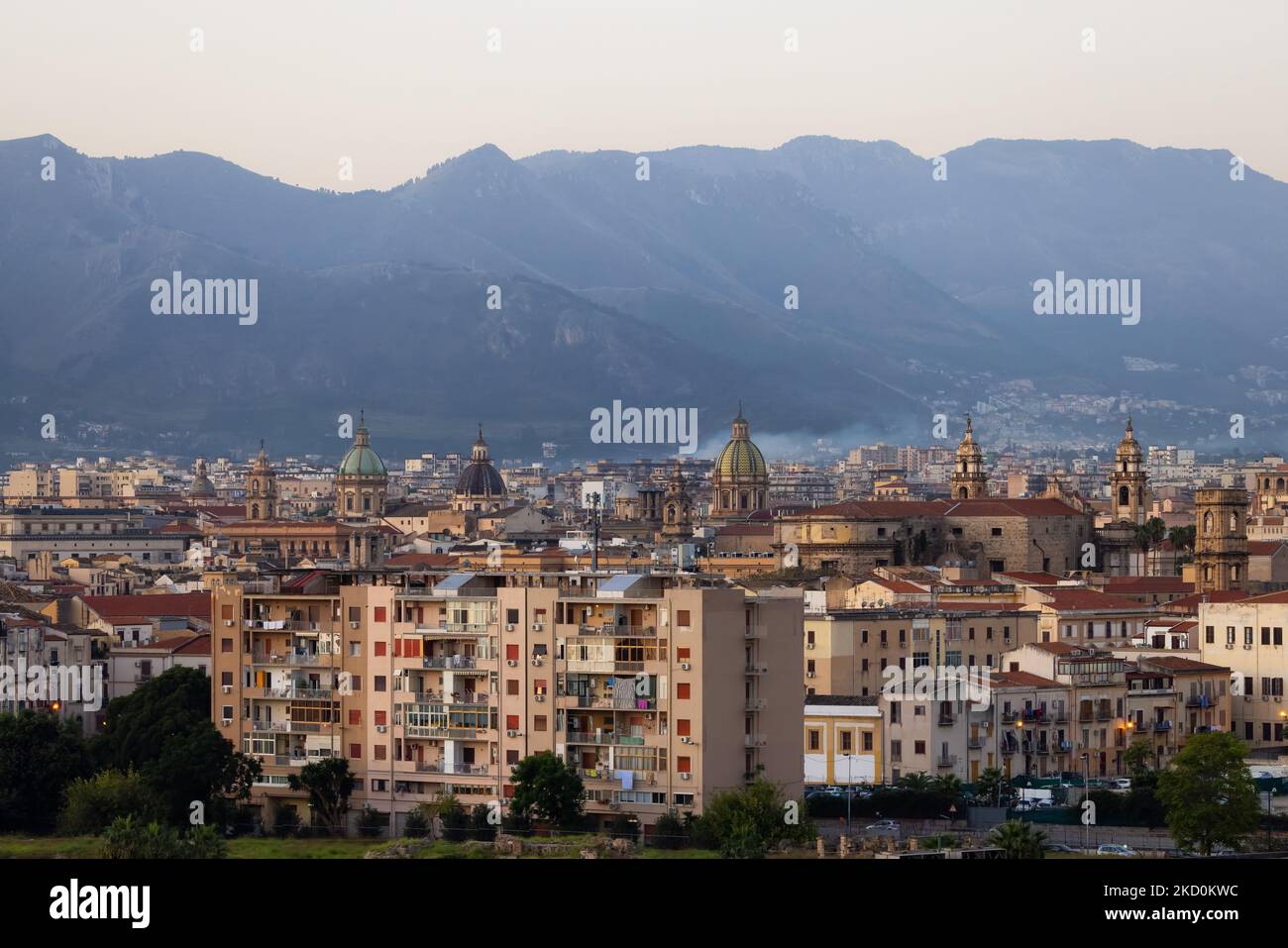 Residential Homes and Historic Church Buildings with mountains in ...