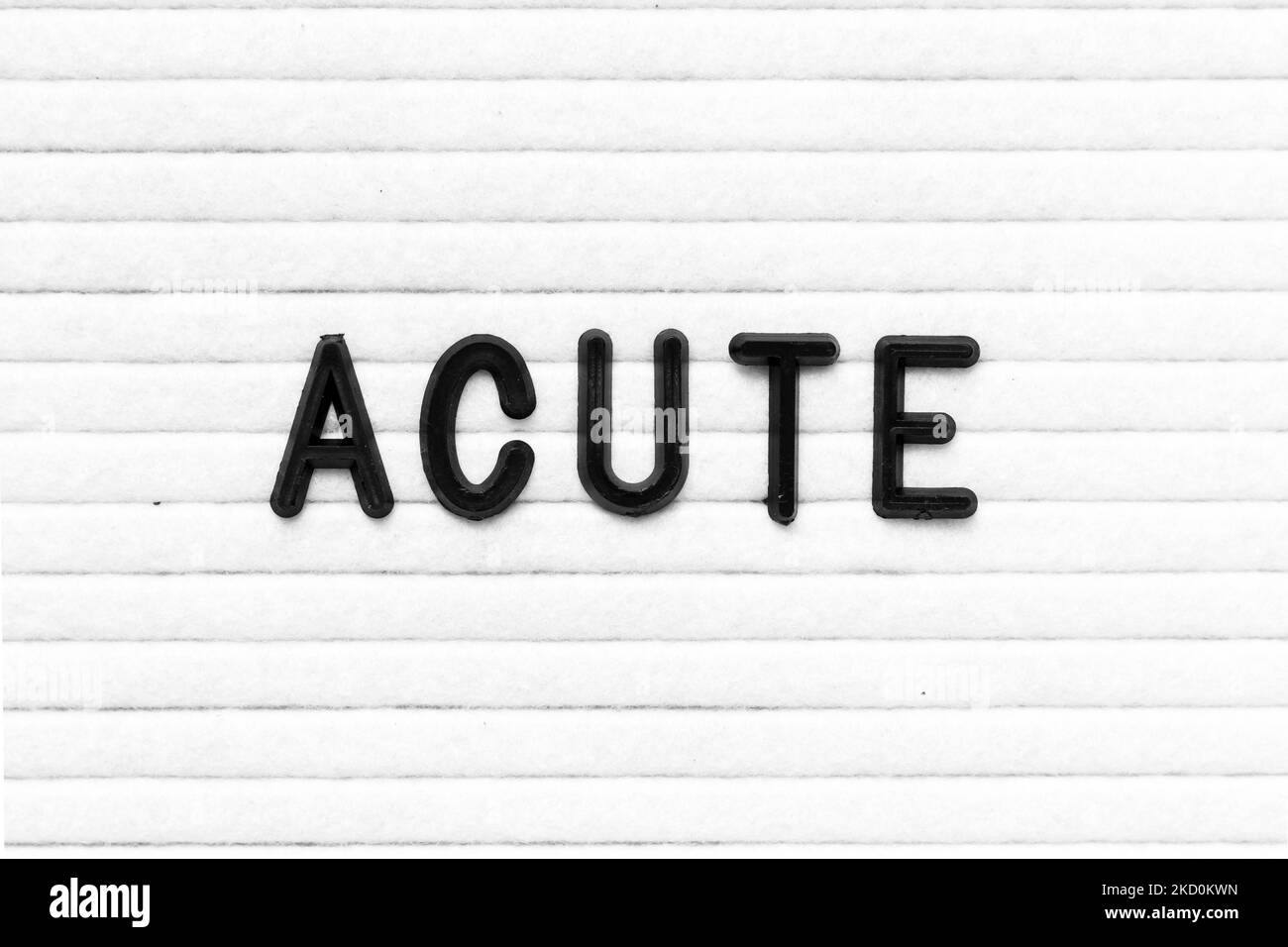 Black color letter in word acute on white felt board background Stock ...