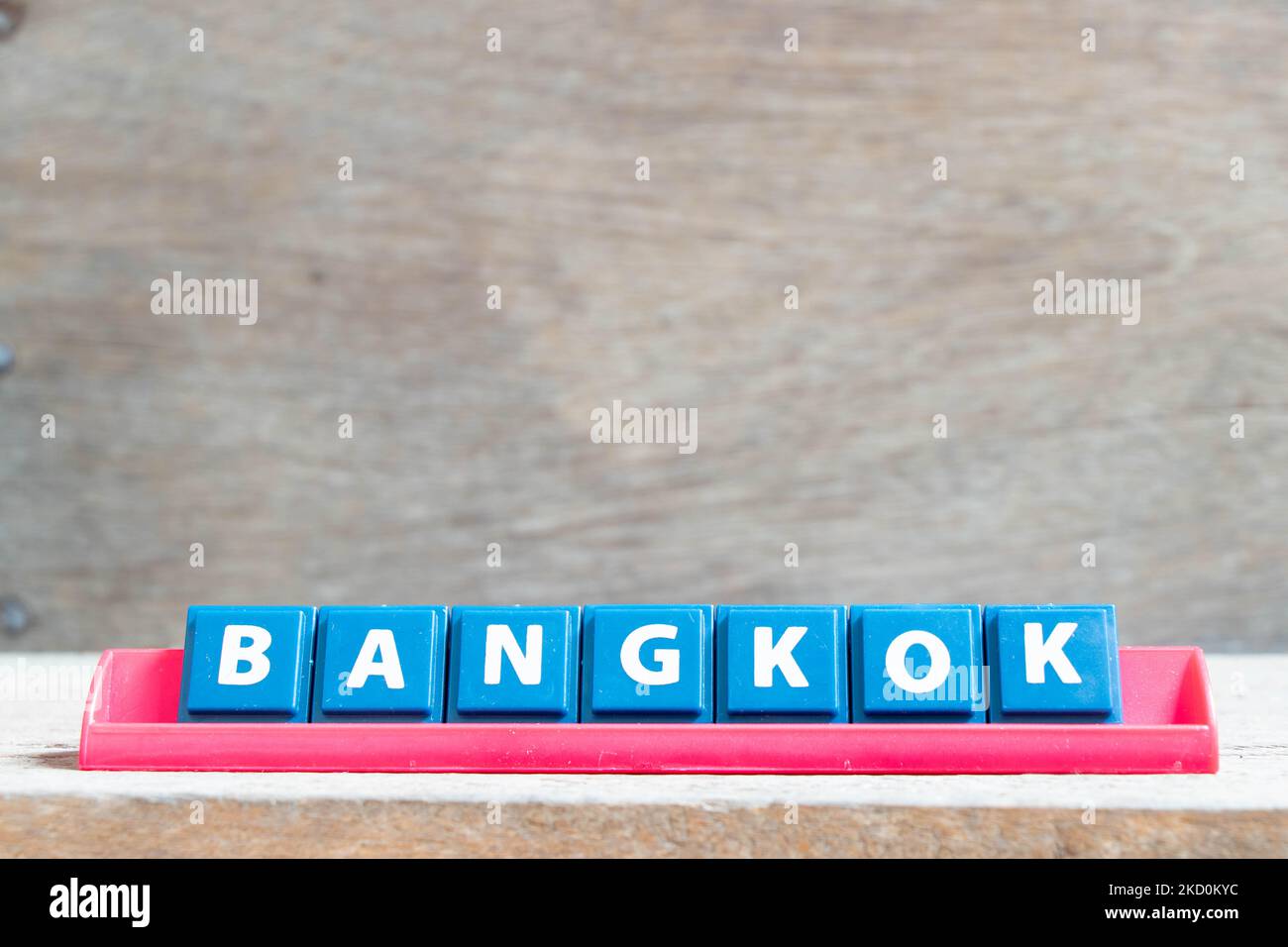 Tile alphabet letter with word bangkok in red color rack on wood ...