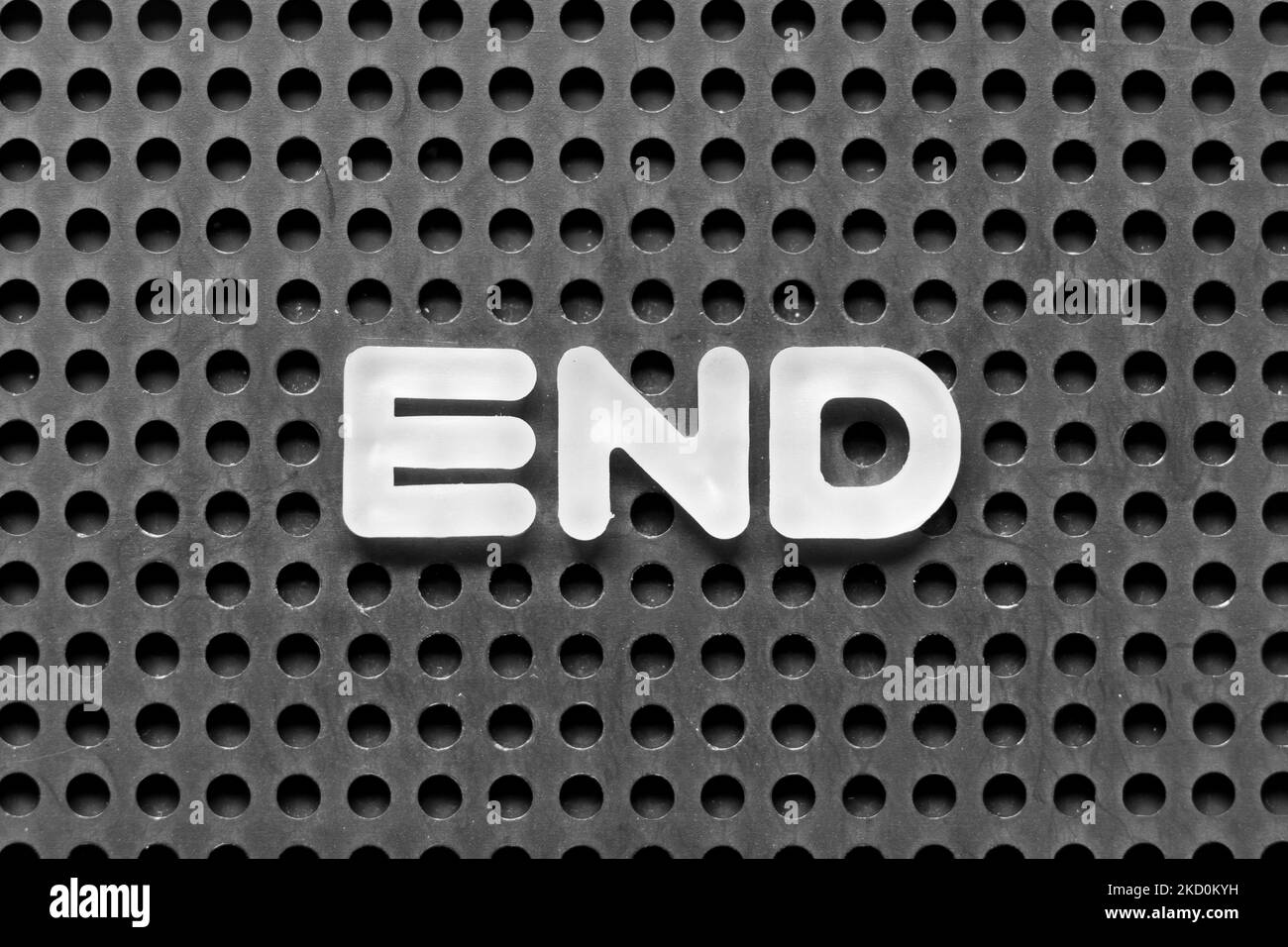 White alphabet letter in word end on black pegboard background Stock ...