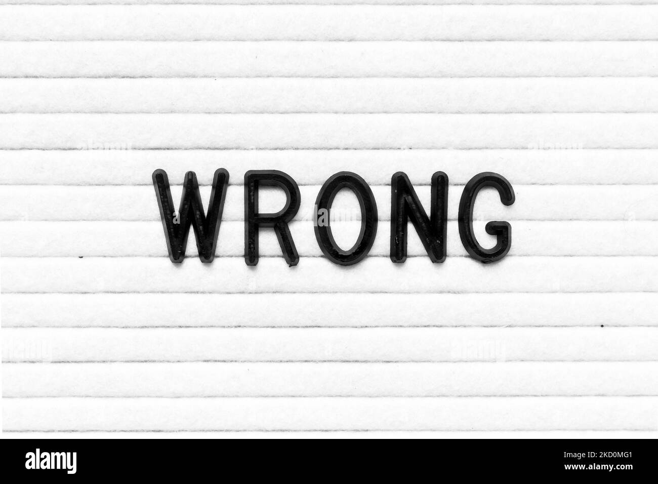 Black color letter in word wrong on white felt board background Stock ...