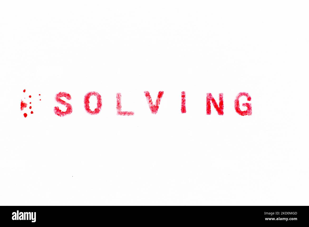 Red color ink rubber stamp in word solving on white paper background ...