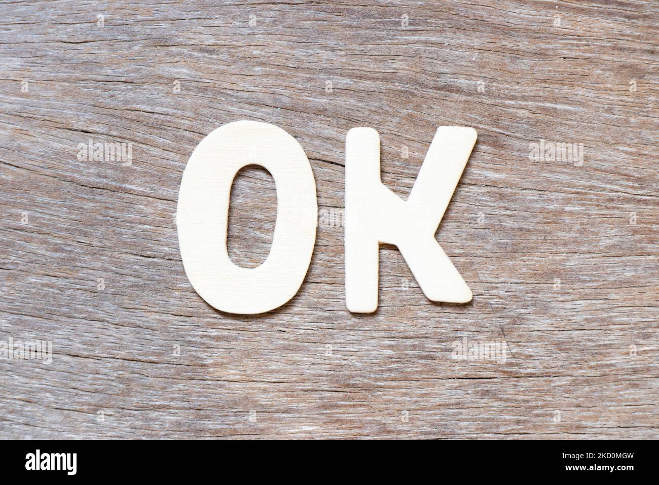Alphabet letter in word ok on wood background Stock Photo - Alamy