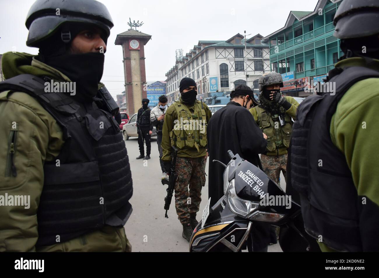 Indian paramilitary troopers frisk a boy in Srinagar, Indian ...