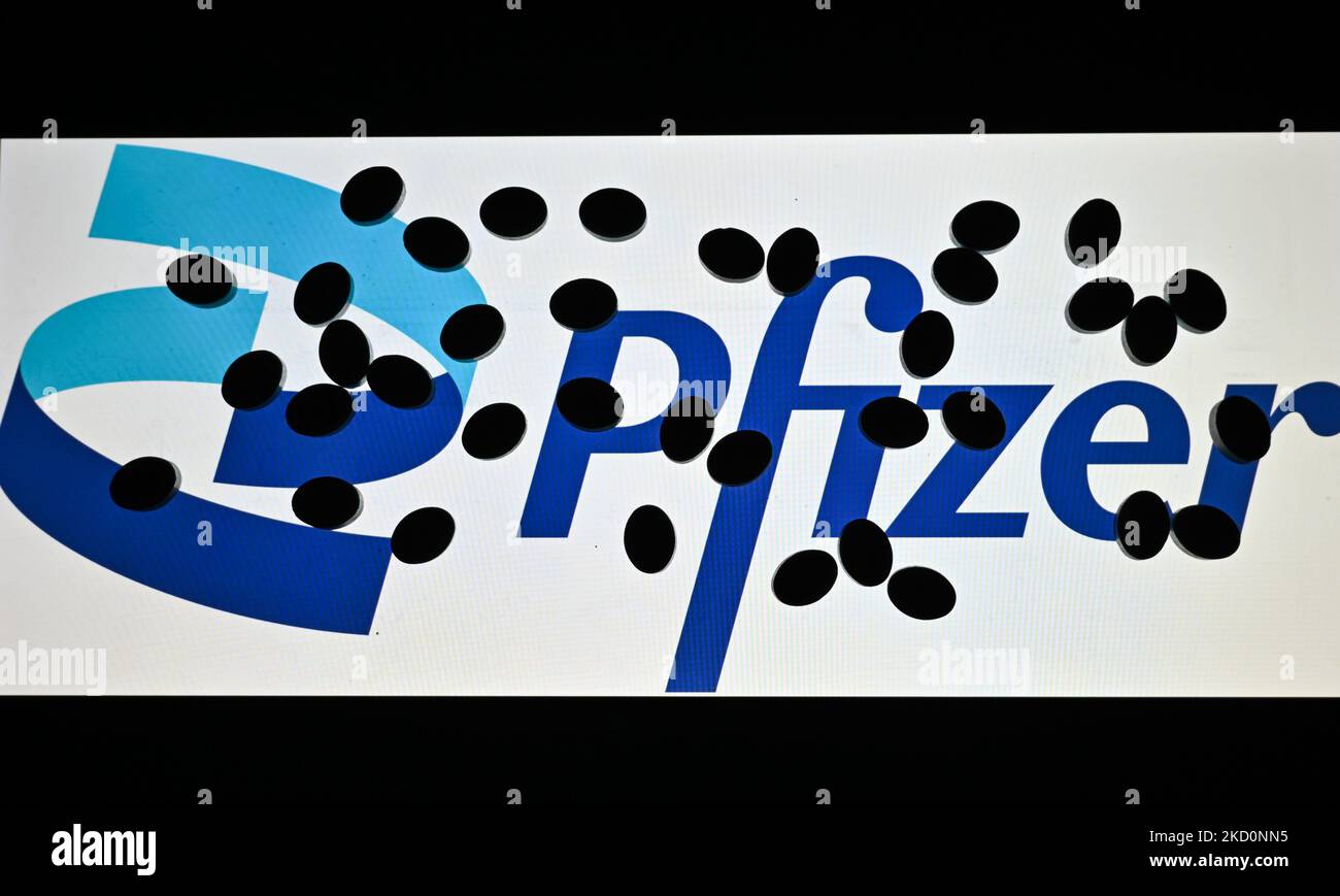 An illustrative image of medical tablets with the Pfizer-logo in the ...