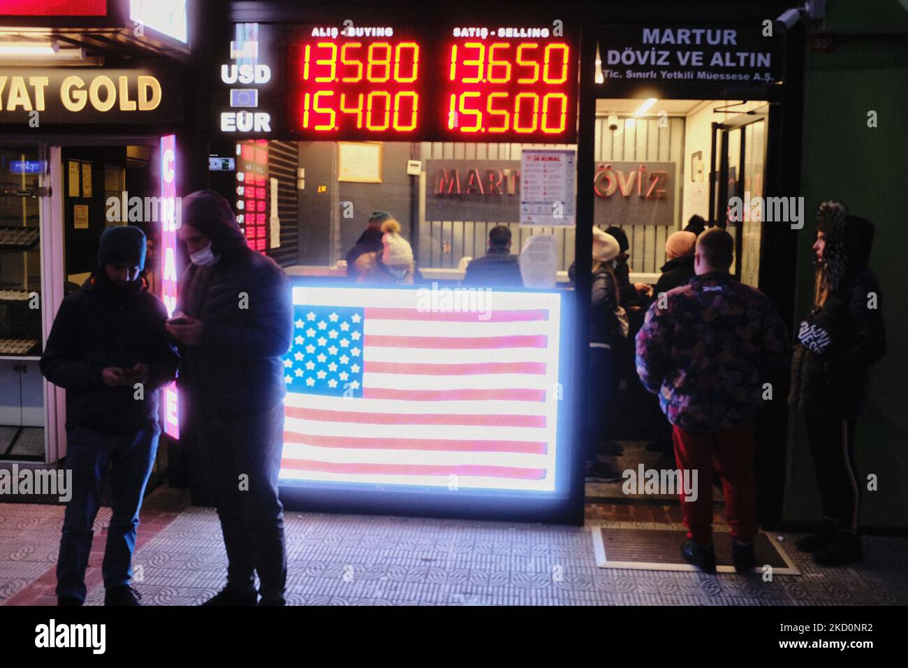 People change money at a currency exchange office in Istanbul, Turkey ...