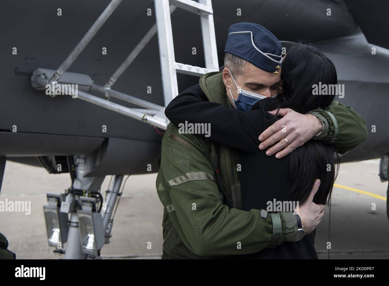 A pilot of the Rafale fighter jets, hugs a woman after he landed, in ...