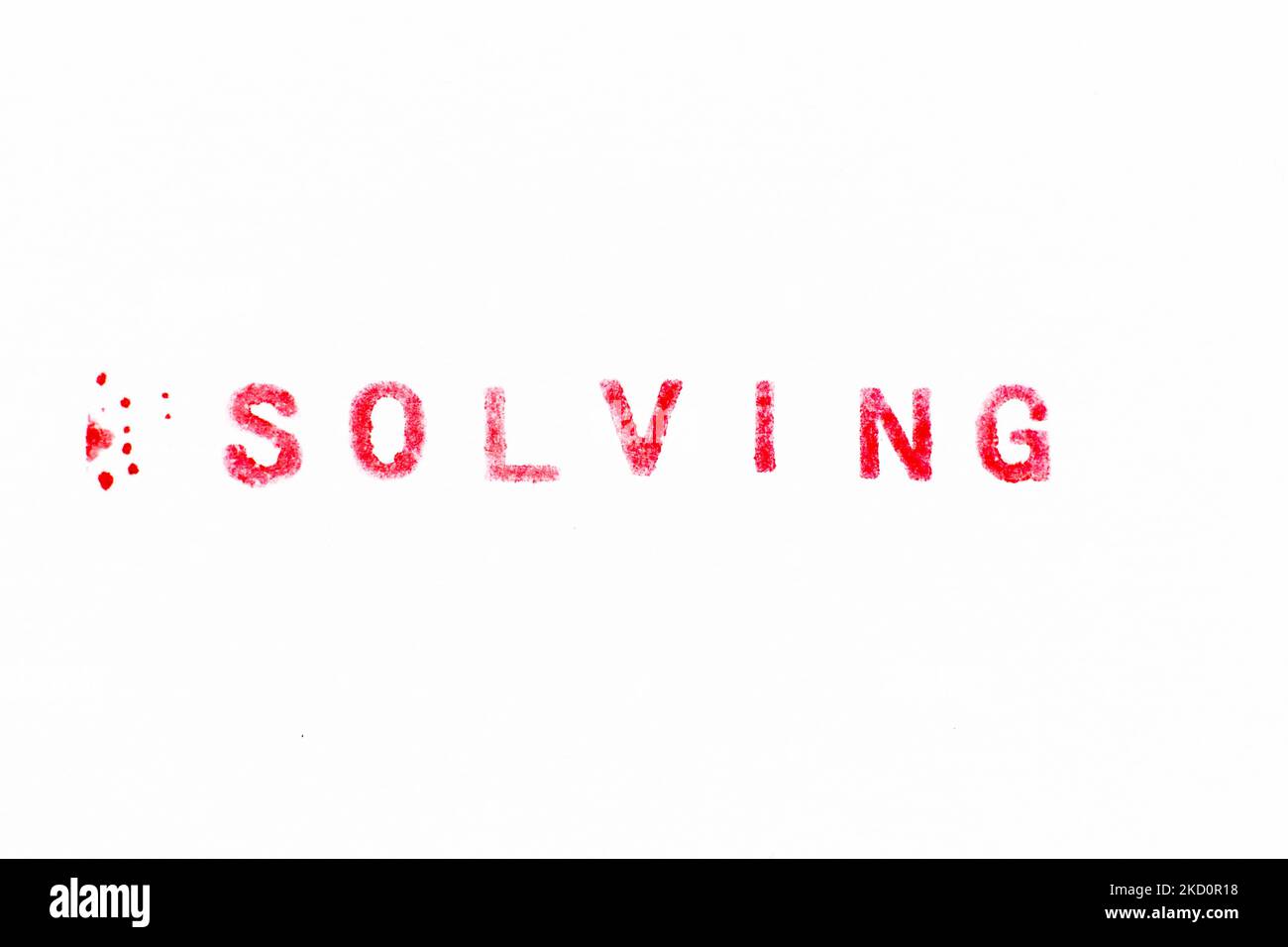 Red color ink rubber stamp in word solving on white paper background ...