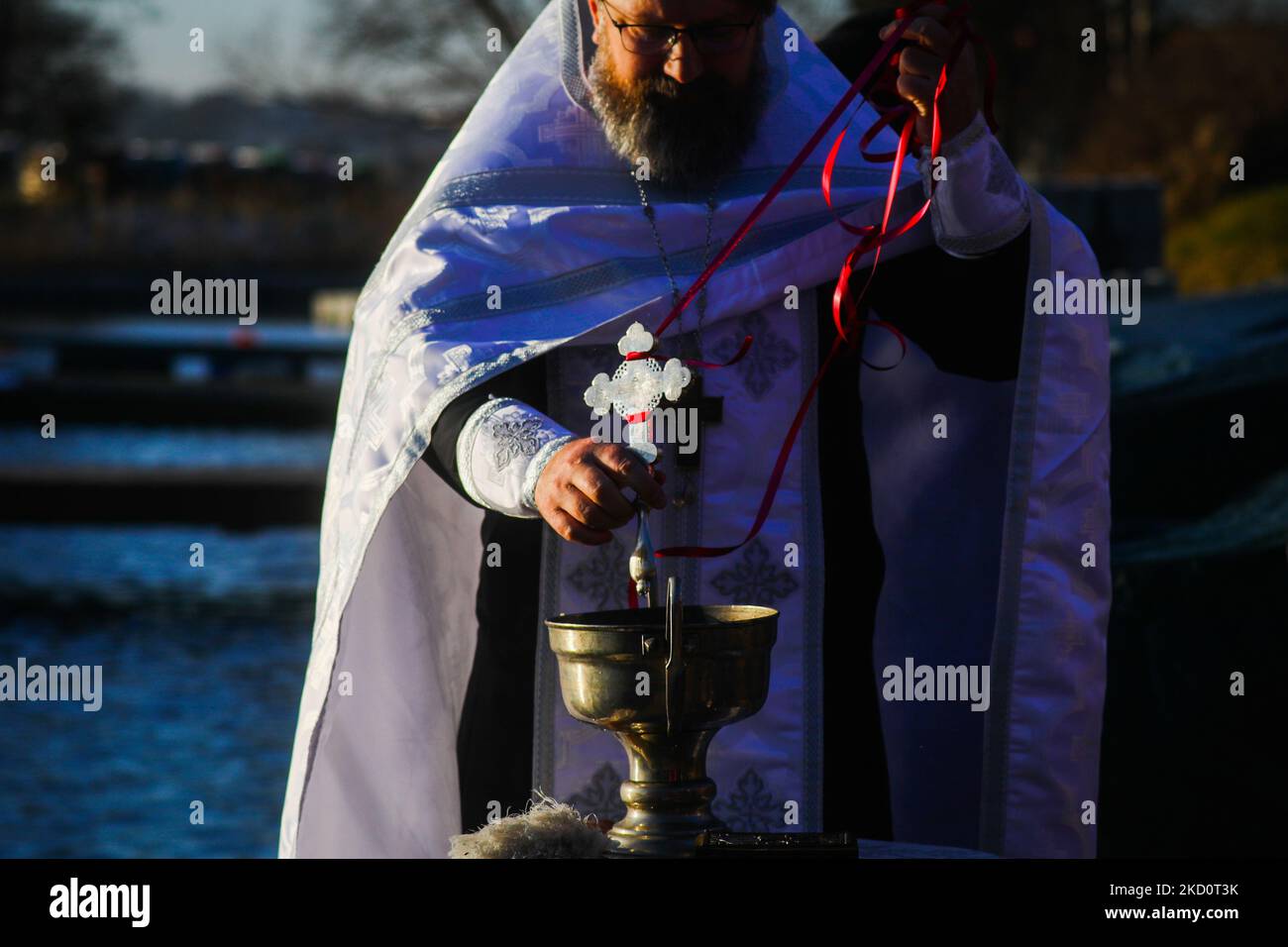 A priest of the Eastern Orthodox Church attends the celebration of the ...
