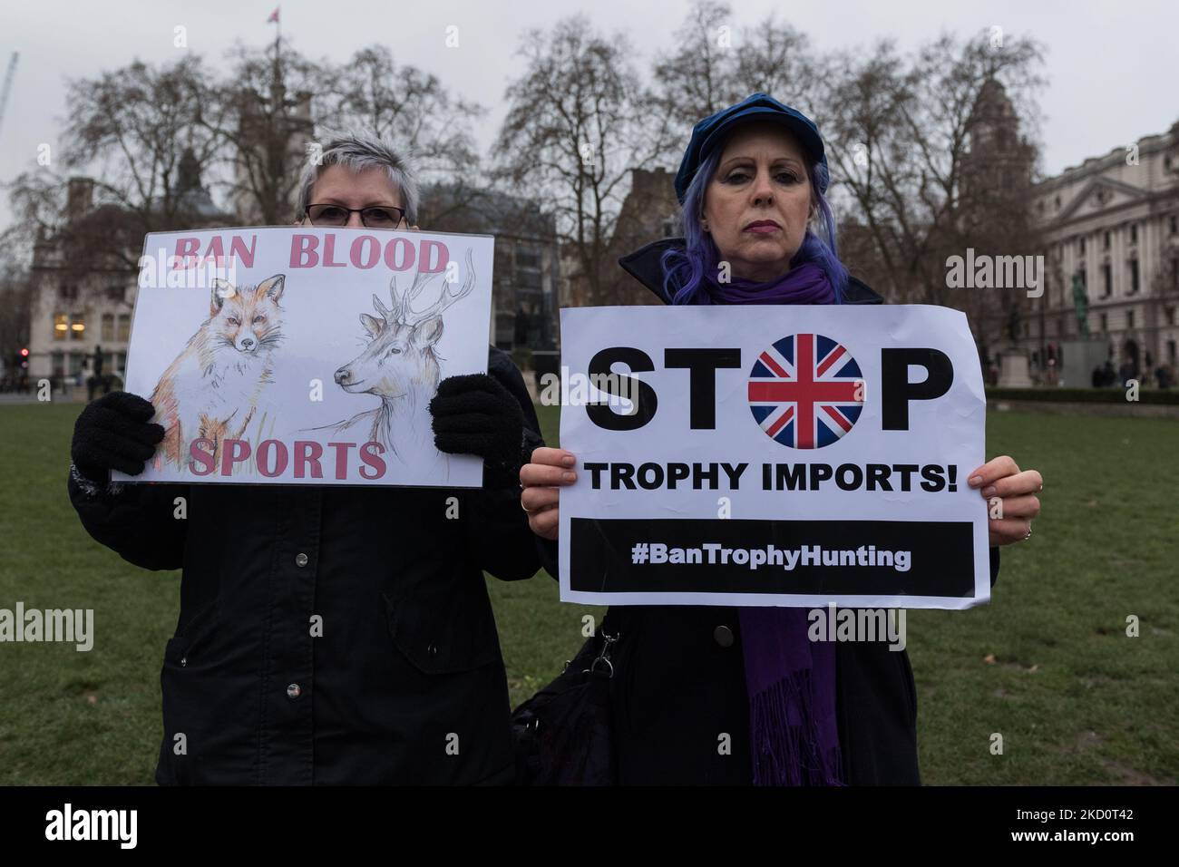 LONDON, UNITED KINGDOM - JANUARY 19, 2022: Demonstrators hold placards ...