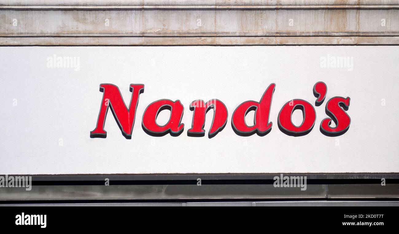Exterior sign of Nando's multinational fast casual chain restaurant in ...