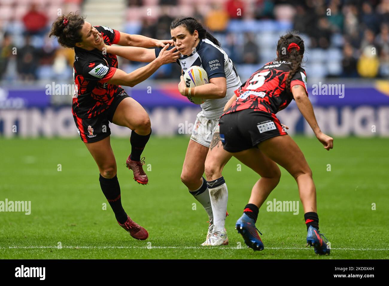 Carrie Roberts of England fends off Gabrielle Hindley of Canada during ...