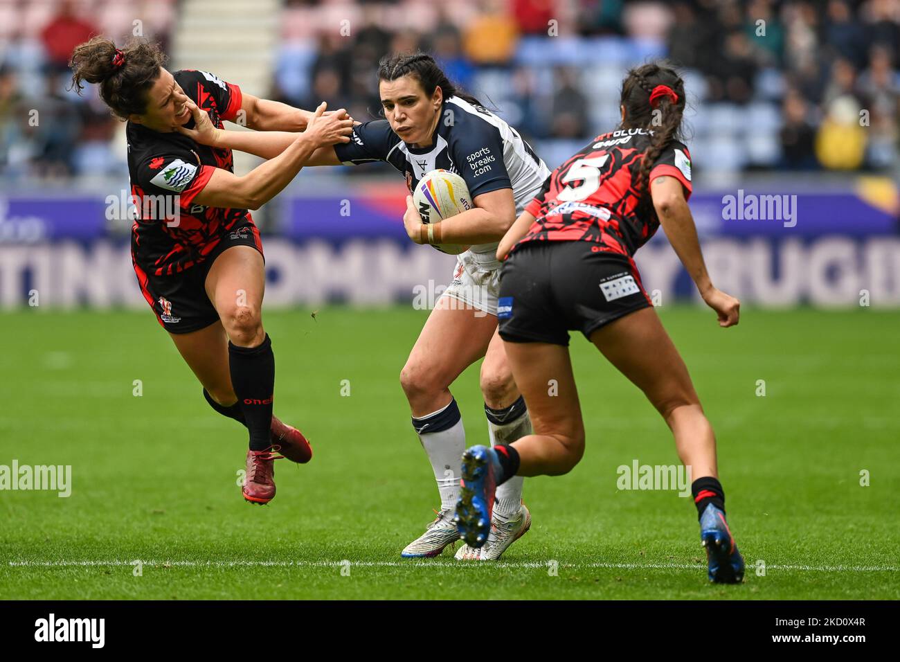 Carrie Roberts of England fends off Gabrielle Hindley of Canada during ...