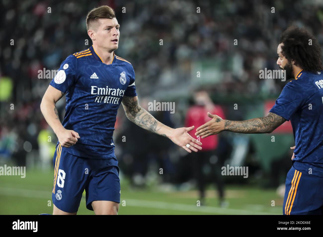 Toni Kroos of Real Madrid (L) and Marcelo Vieira da Silva of Real ...