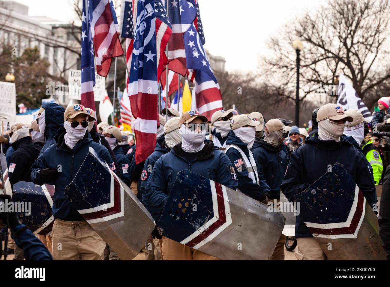 White supremacist group Patriot Front stands in formation protected by ...