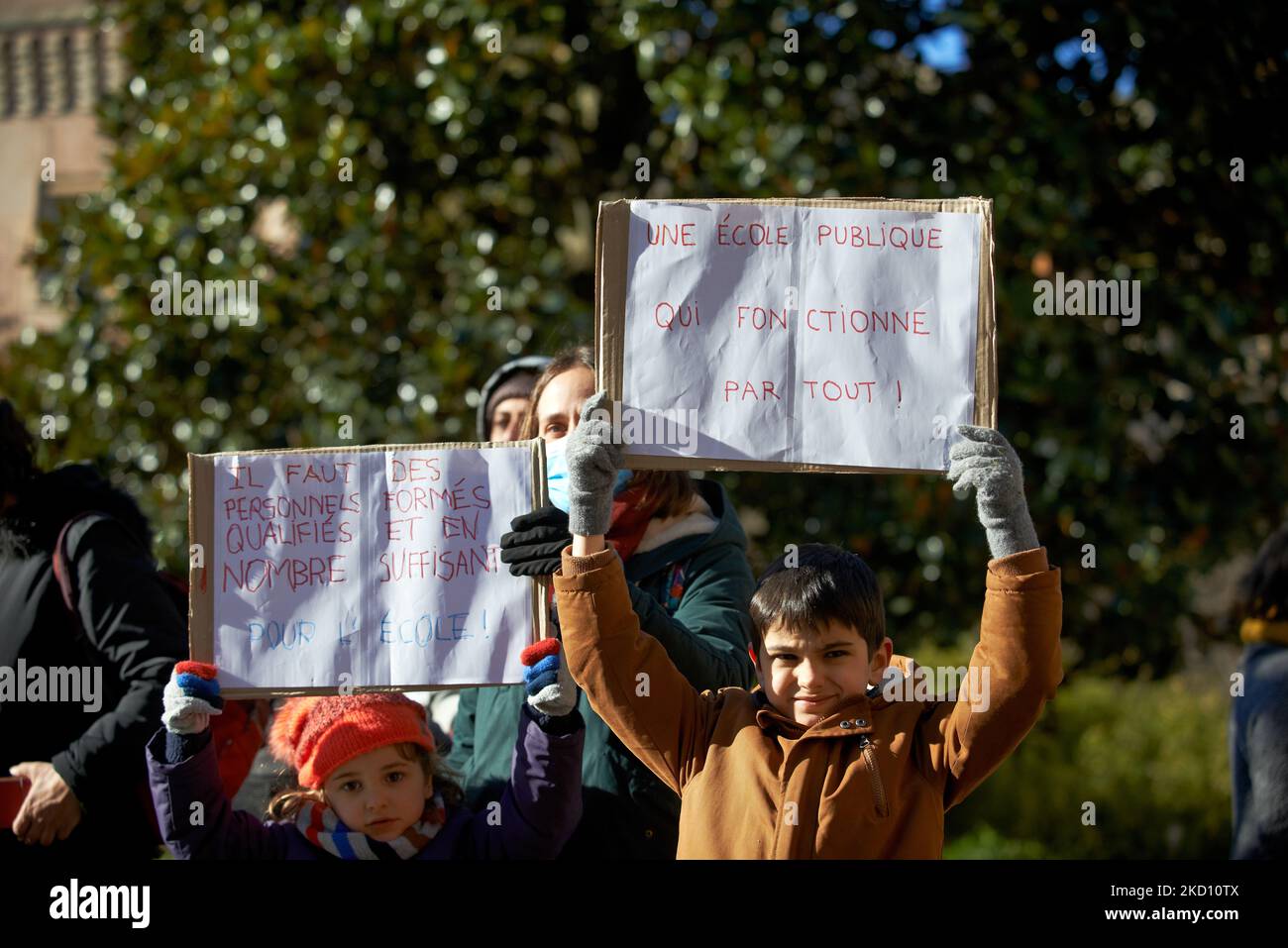 Two children hold placards during the gathering. Teachers unions (FSU ...
