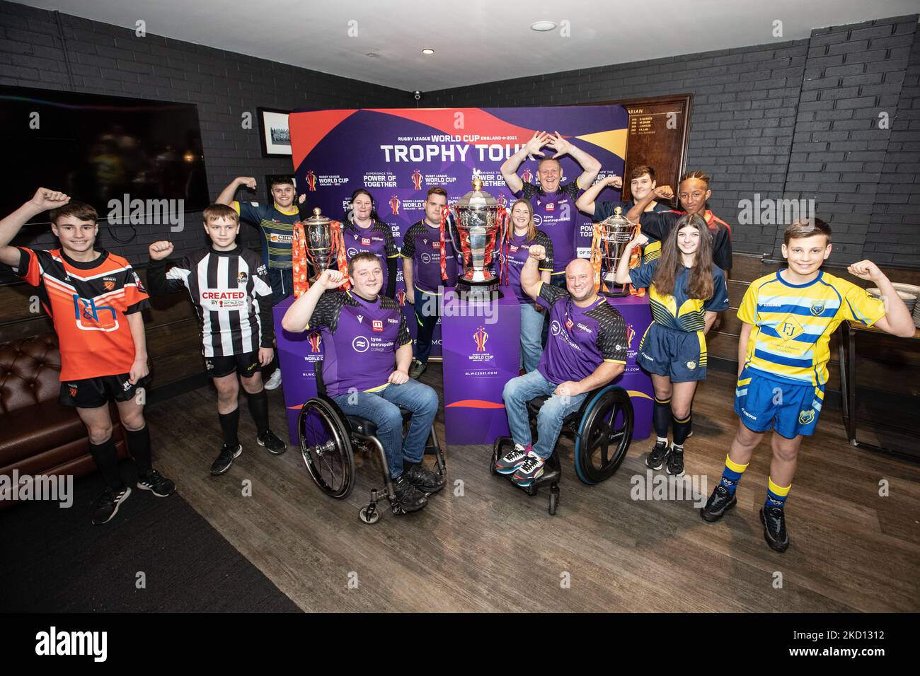 Playing members of Newcastle Thunder pictured with the trophies ...