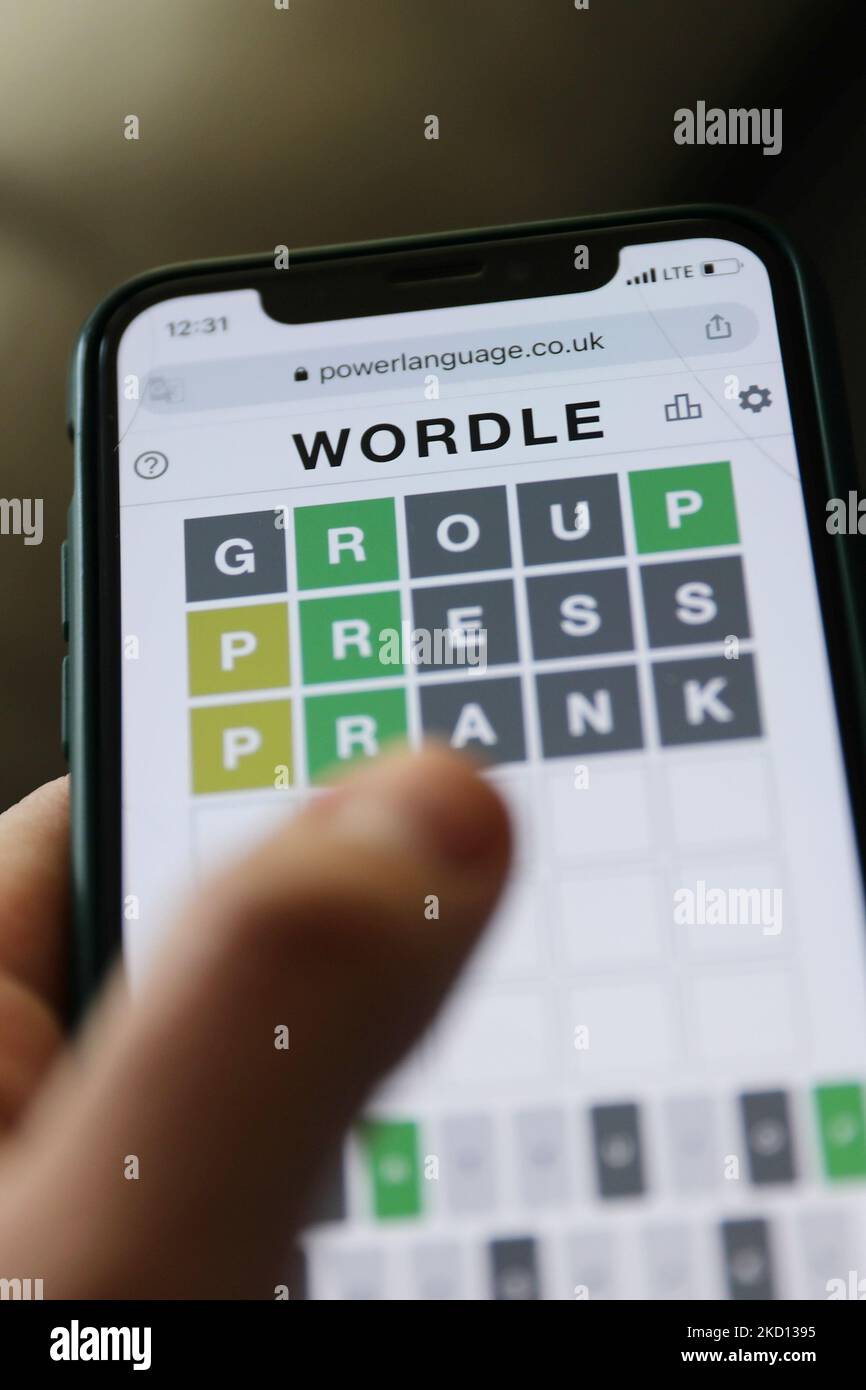 Wordle game displayed on a phone screen is seen in this illustration ...