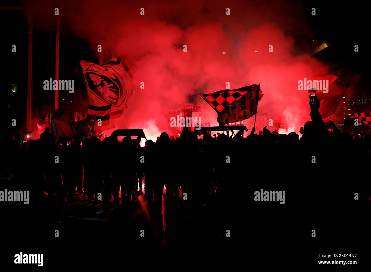AC Milan Curva Sud fans light smoke bombs and sing outside the stadium ...