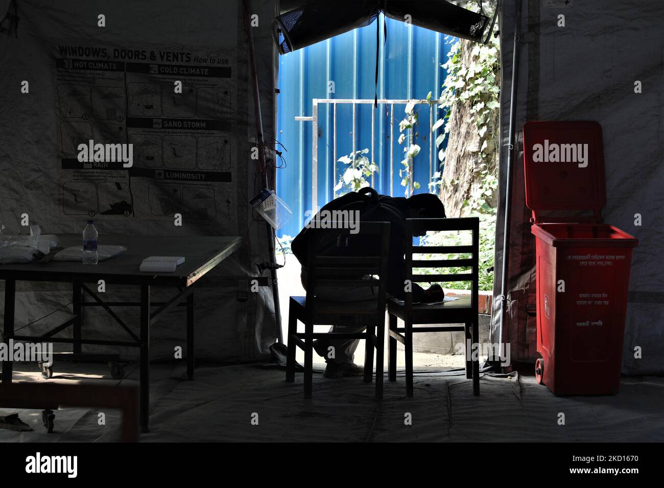 A man fills a form at a sample collection booth to get tested for the ...