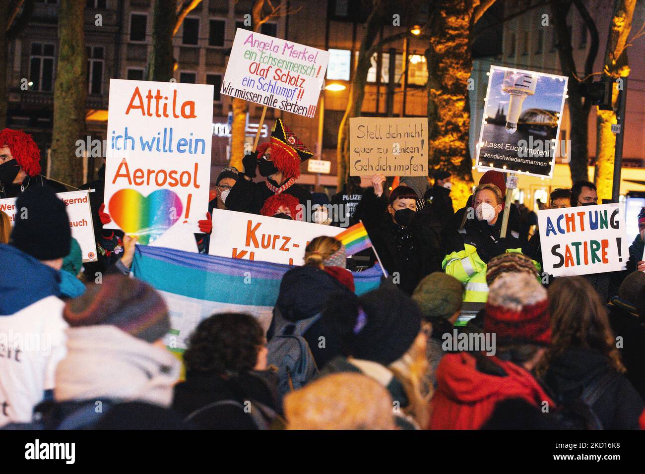 counter protesters are seen holding the signs against anti vaccination ...