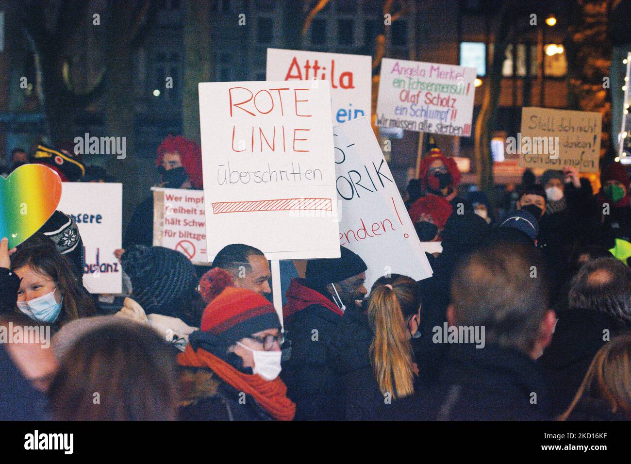counter protesters are seen holding the signs against anti vaccination ...