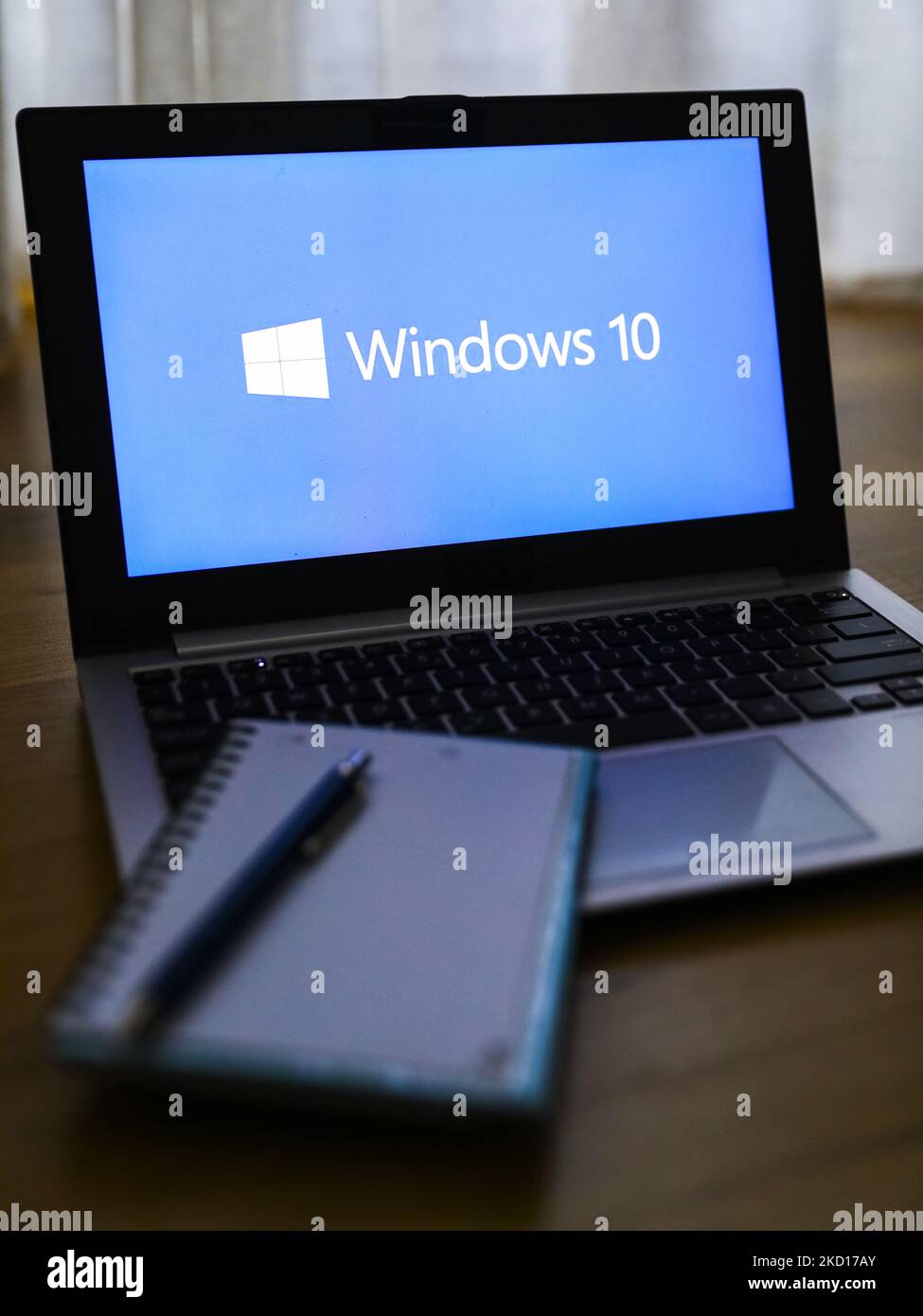 Windows 10 operating system logo is displayed on a laptop screen for ...