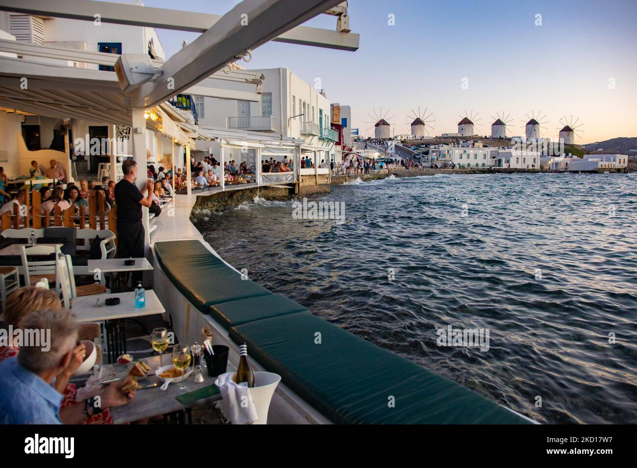 The iconic windmills of Mykonos island as seen from Little Venice with ...