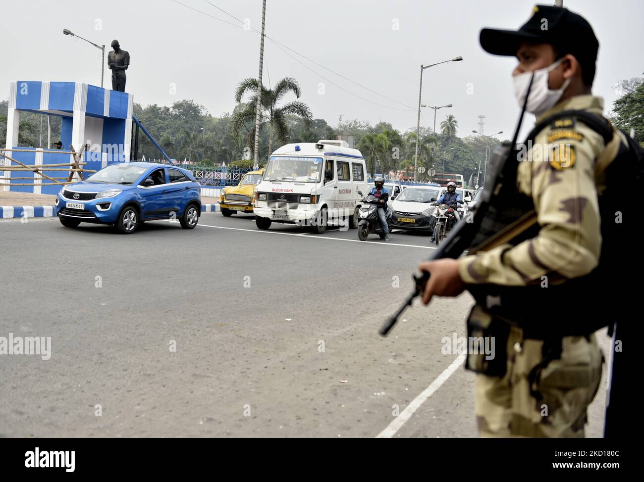 A Kolkata police commando holds a gun as a part of preparation of ...