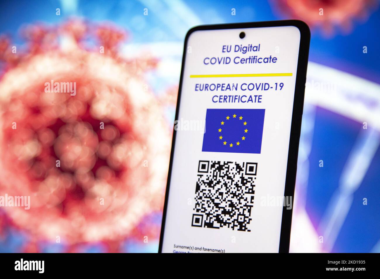 Photo illustration of a hand holding and showing the display of a ...