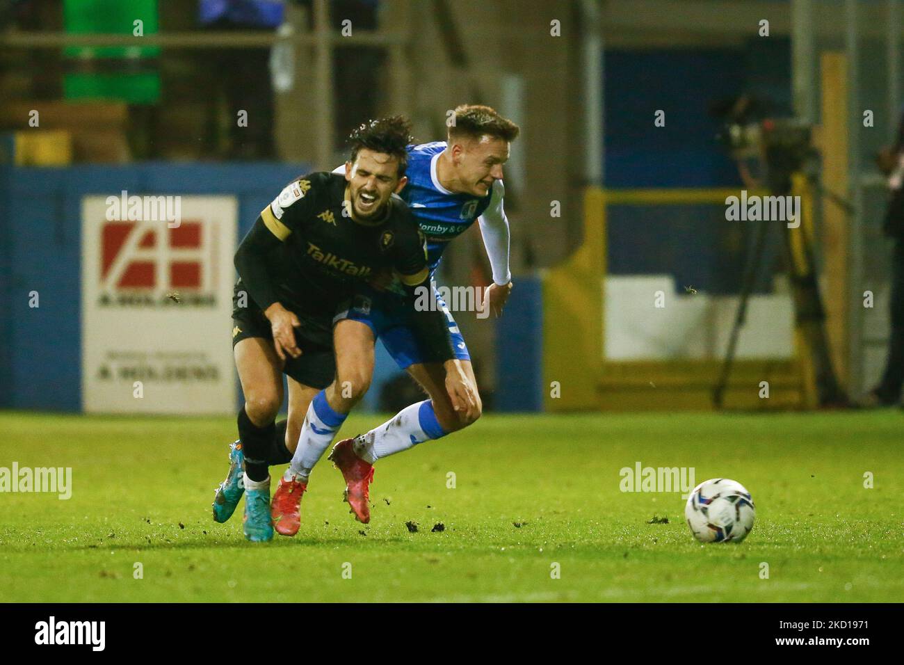Jason Lowe of Salford City and Josh Kay of Barrow in action during the ...