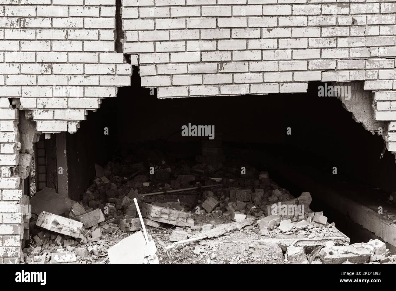 Building exterior brick wall with extreme damage cracks holding up from ...