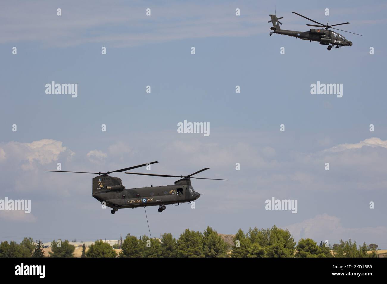 A Boeing AH-64 Apache helicopter from the Greek Army with a Boeing CH ...